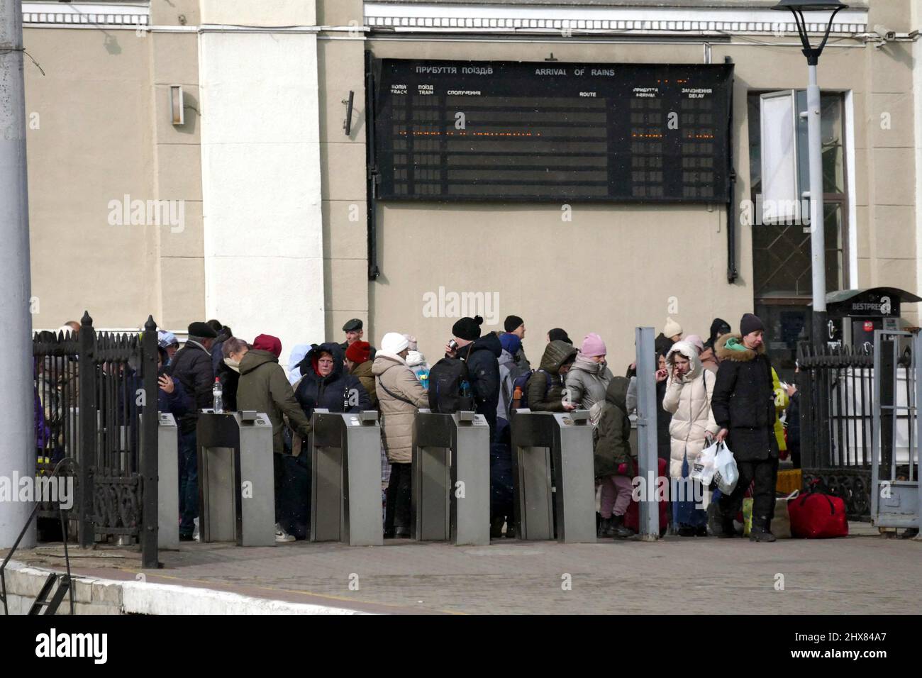 People stand in line to board the Odessa-Rakhiv evacuation train, Odesa ...