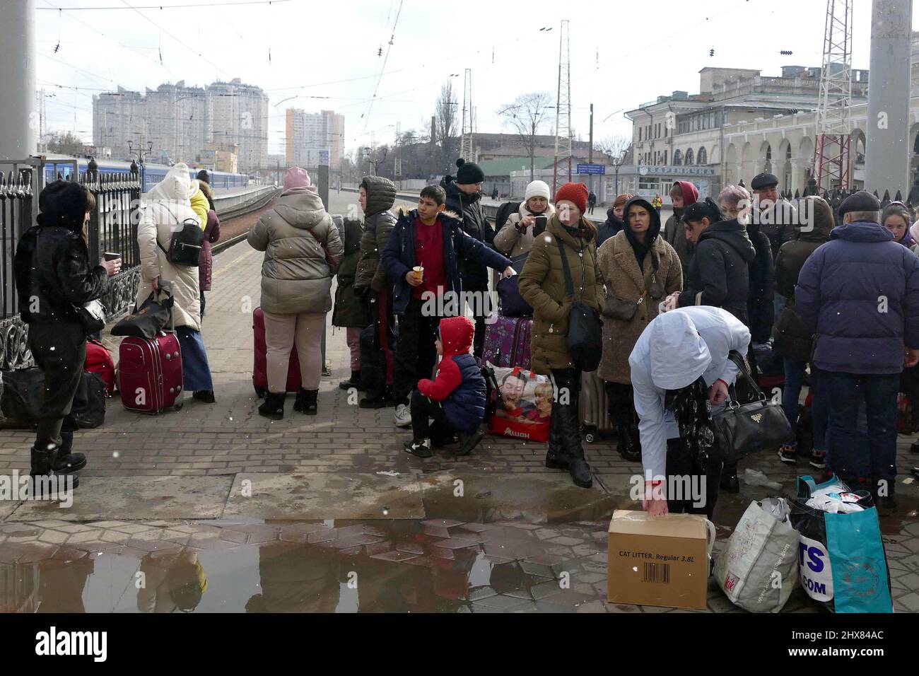 People stand in line to board the Odessa-Rakhiv evacuation train, Odesa ...