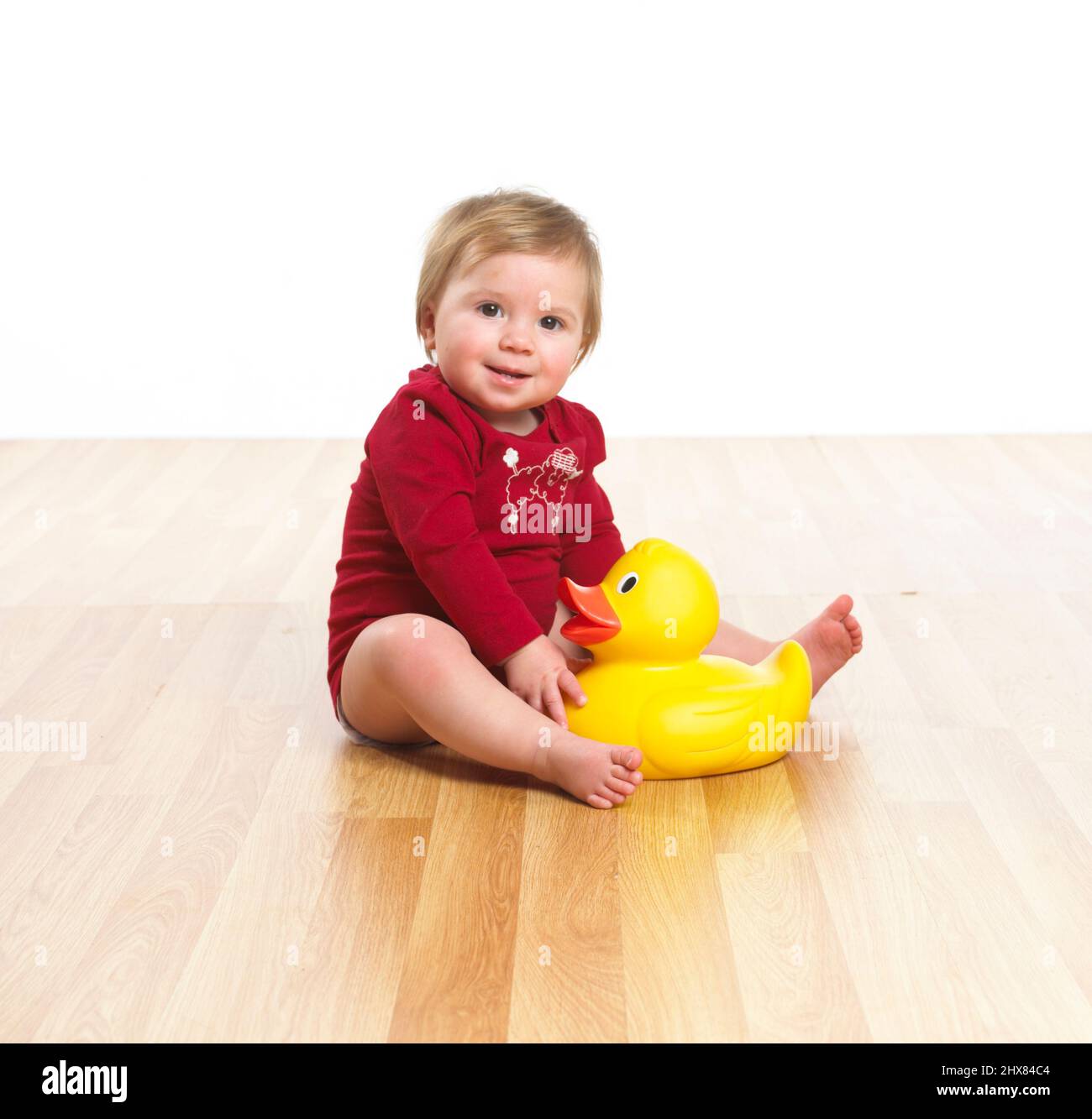 Baby holding rubber duck hi-res stock photography and images - Alamy