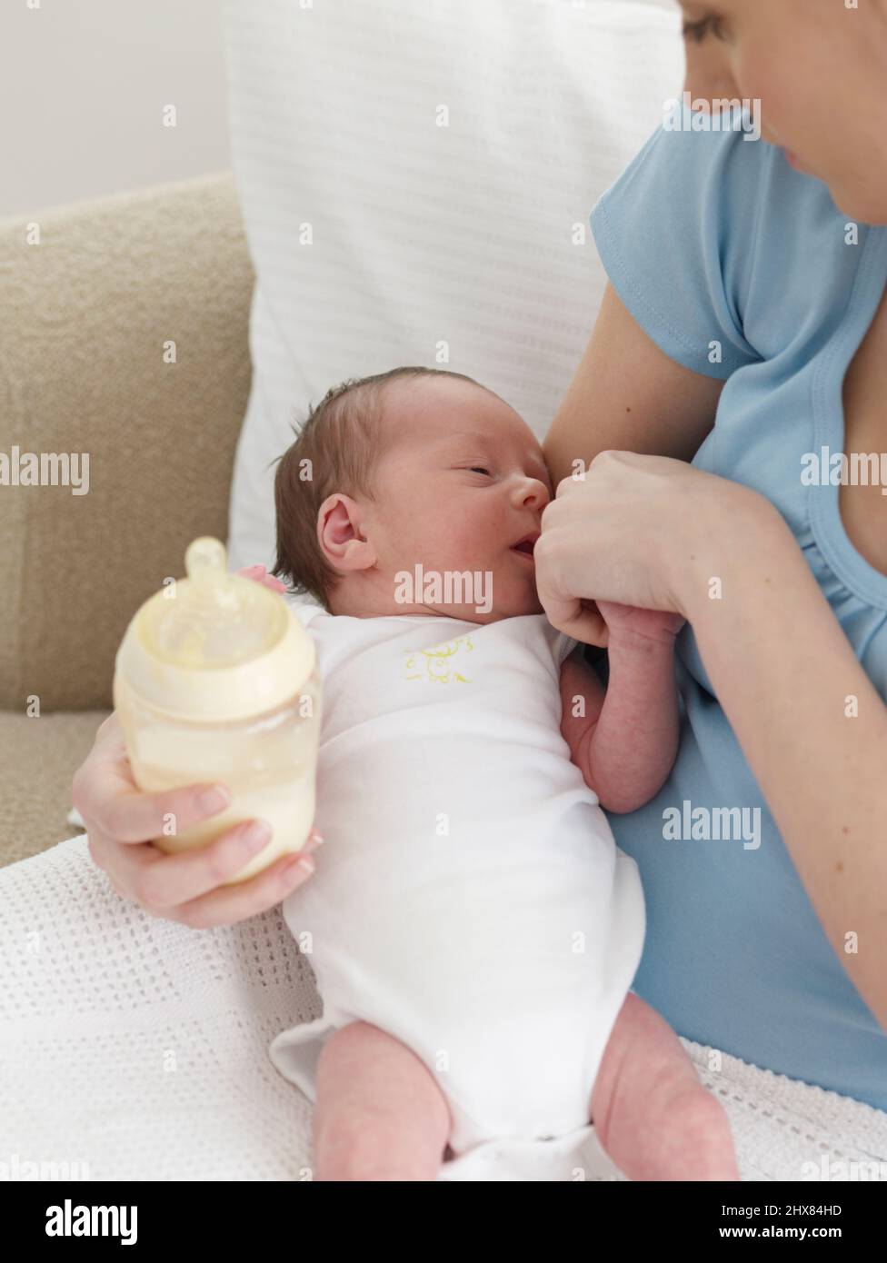 Mother touching baby cheek hi-res stock photography and images - Alamy