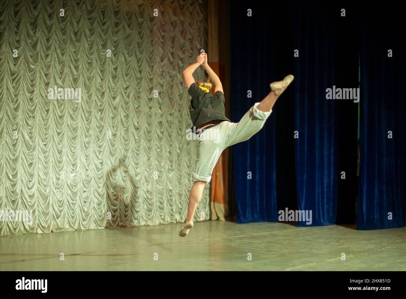 Ballerina jumps. Jump in dance. Dance teacher shows movement. Dance ...