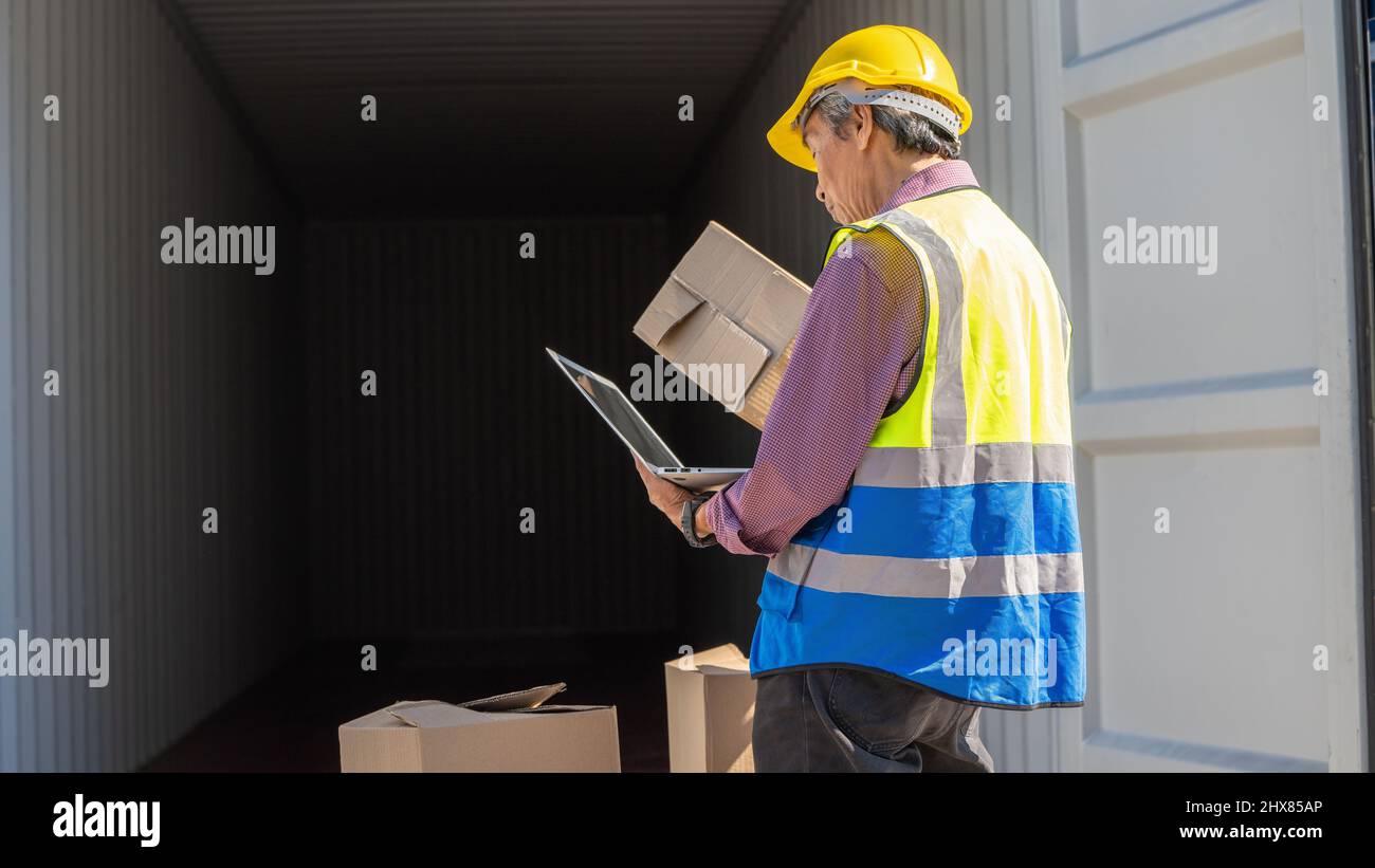 Old Manager with labtop computer inspector or Safety Supervisor in ...