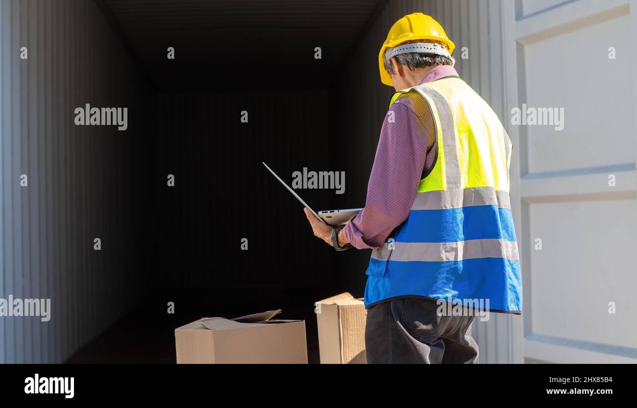 Old Manager with labtop computer inspector or Safety Supervisor in ...