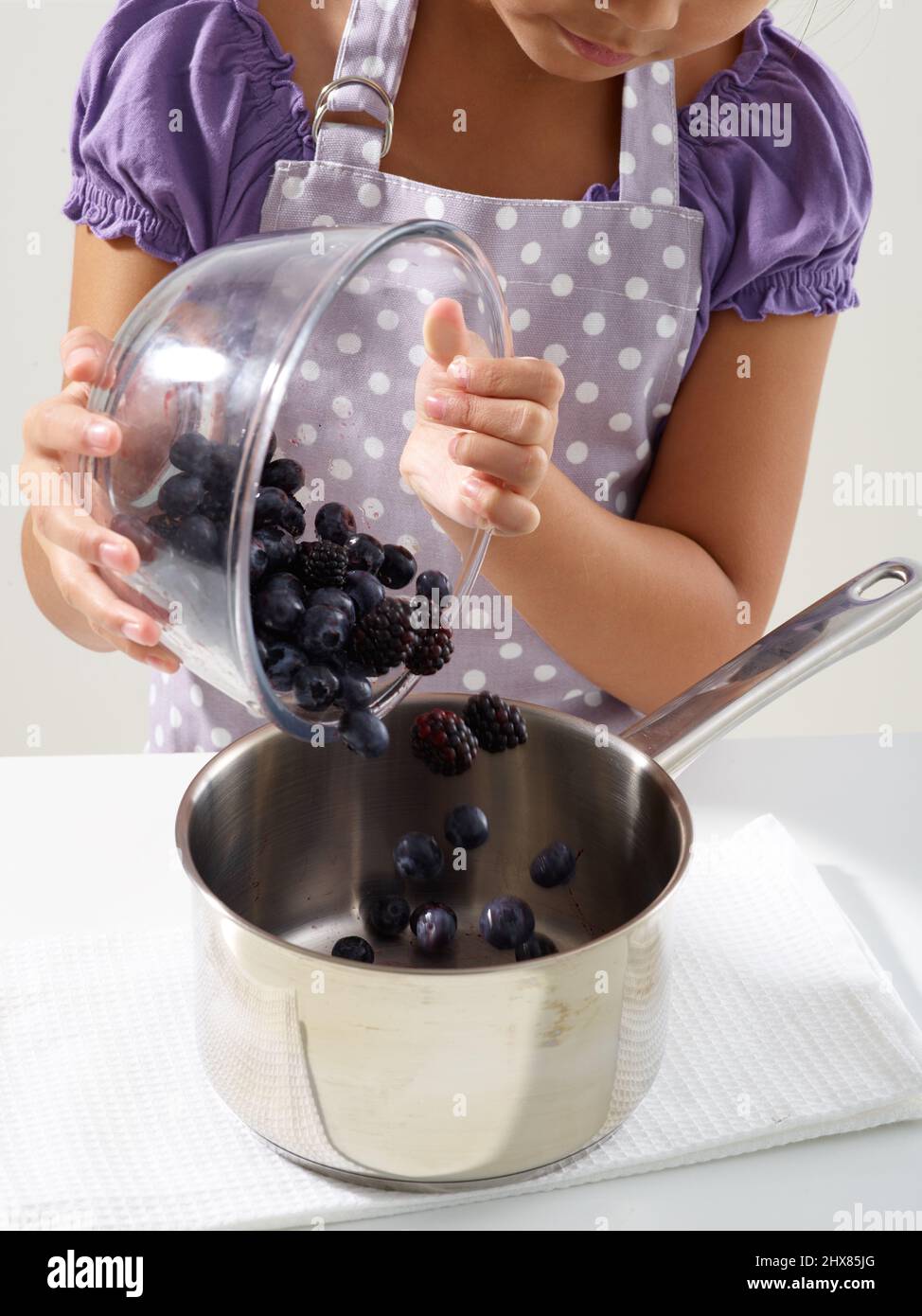 Layered Berry Cheesecakes - Cooking berries in a panÔøΩ(Step 1 of 4 ...