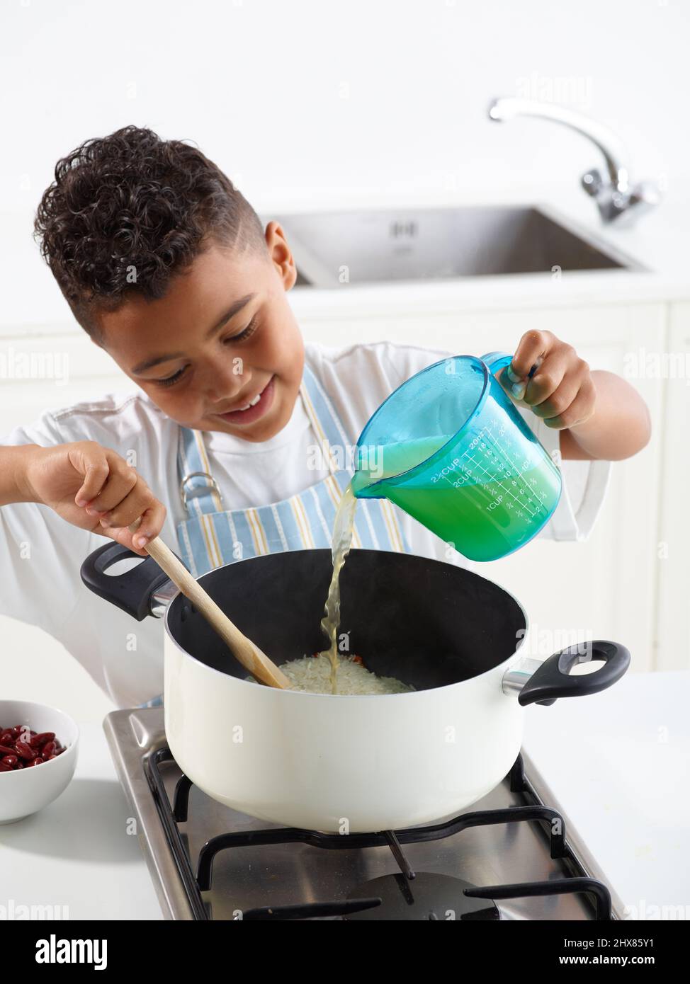 Veggie Jambalaya - Adding vegetable stock to a pan (Step 3 of 5 Stock ...