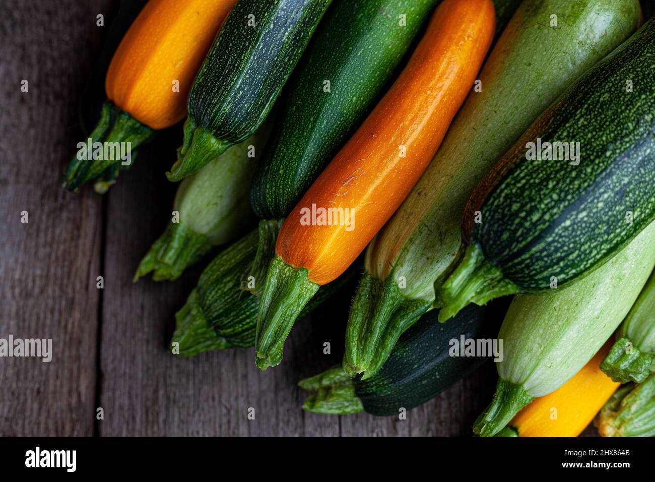 A set of multi-colored zucchini yellow, green, white, orange on the ...