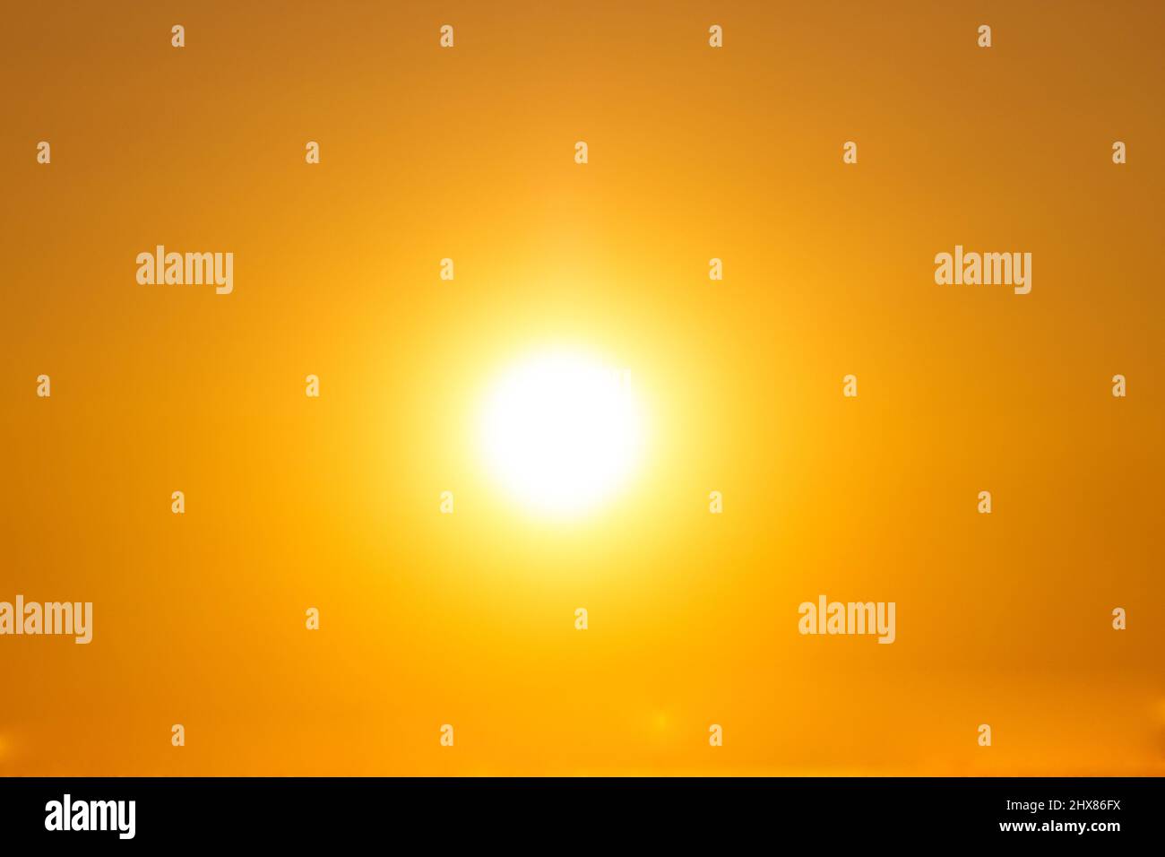 Natural sky background. Golden colored sun Stock Photo - Alamy