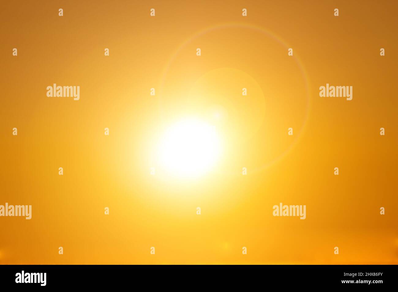 Natural sky background. Golden colored sun Stock Photo - Alamy