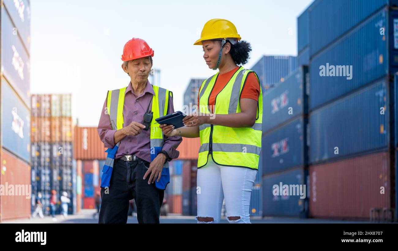 Woman inspector or Safety Supervisor and Old delivery man in Container ...