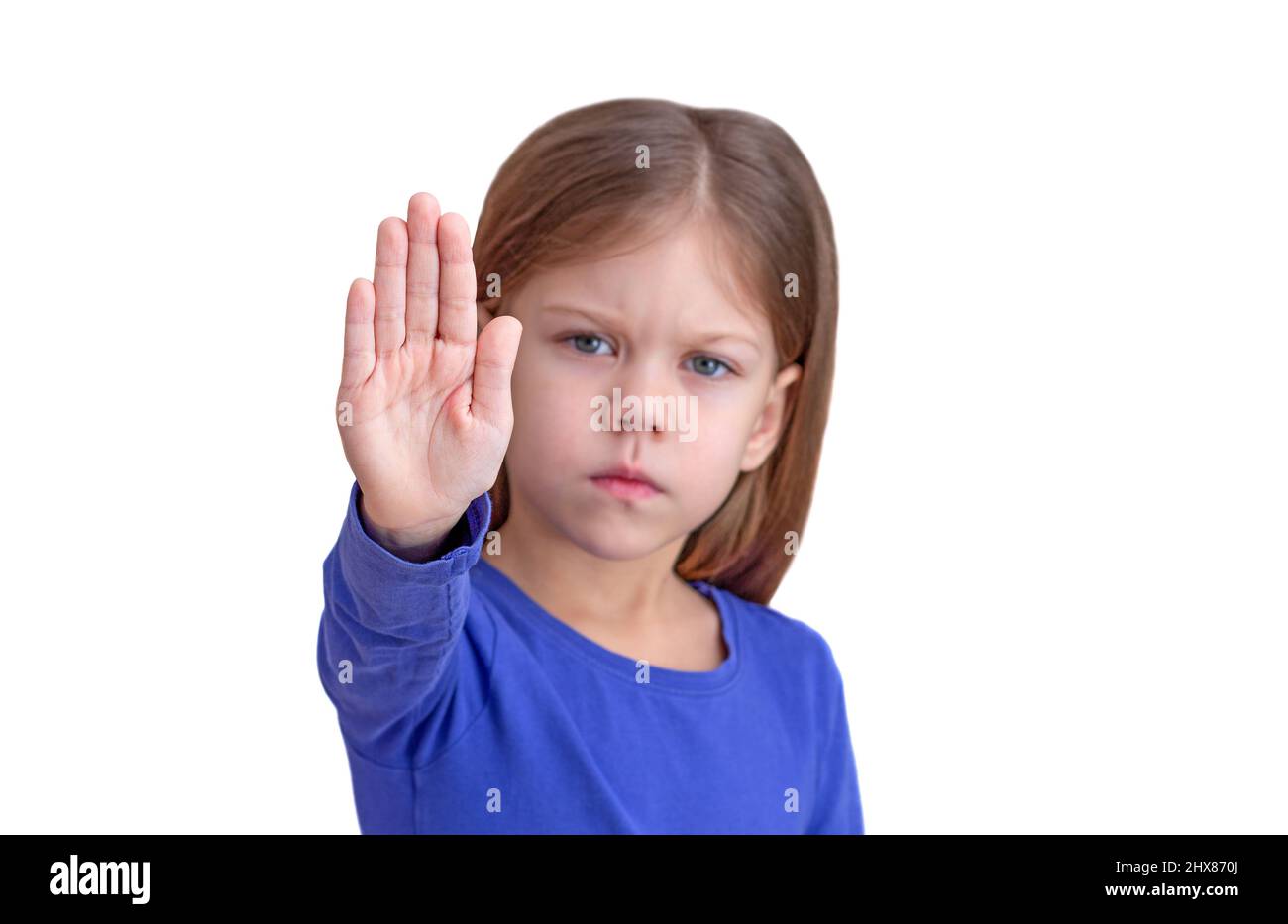 Child showing hand as sign to stop focus on palm, isolated on white ...