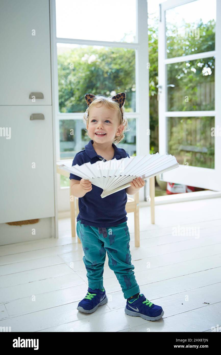 Little boy playing dressing up (Model aged 2 Stock Photo - Alamy