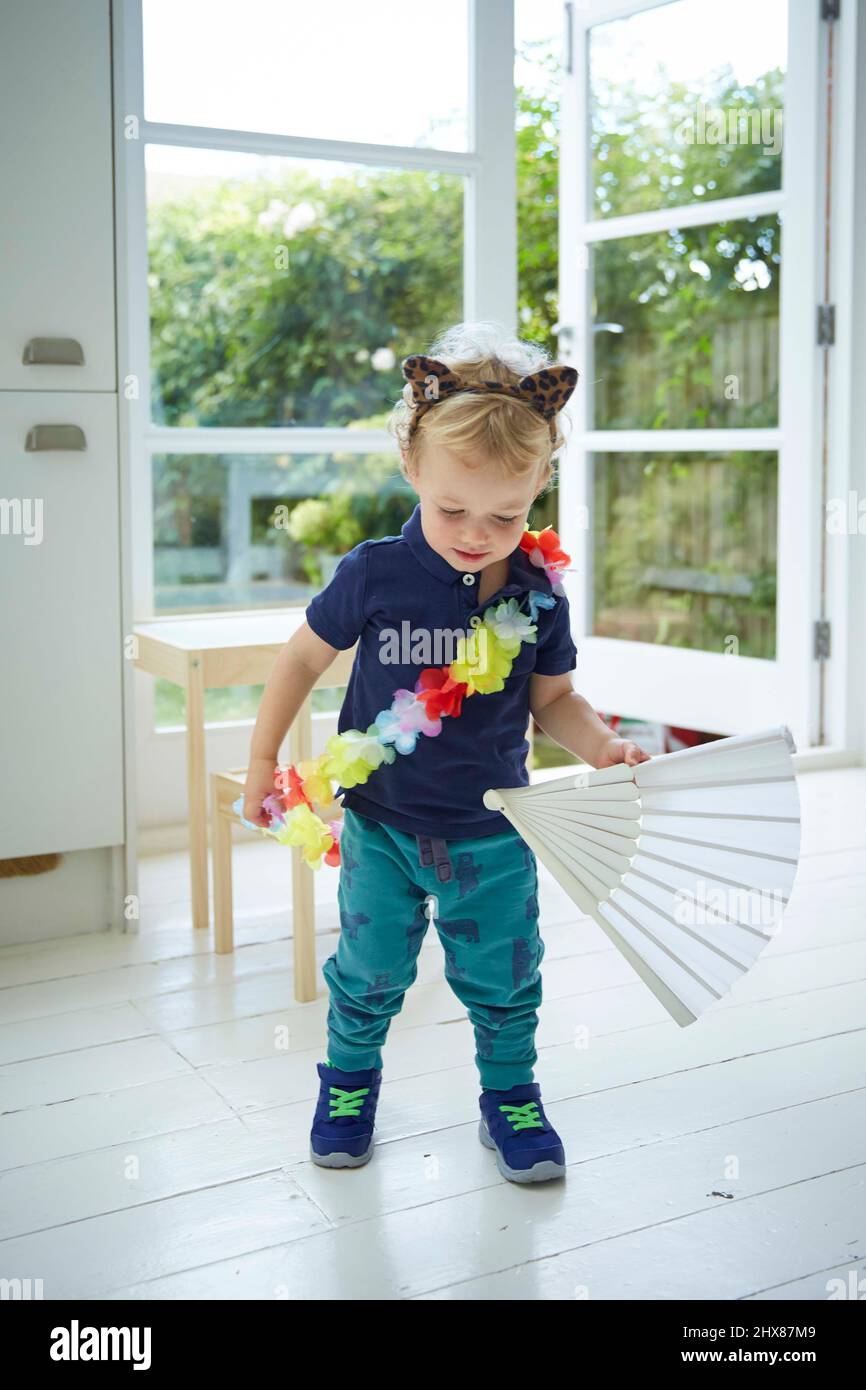 Little boy playing dressing up (Model aged 2 Stock Photo - Alamy