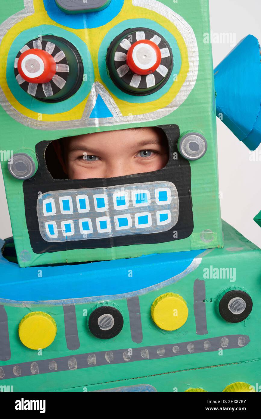 Boy wearing cardboard robot costume Stock Photo - Alamy