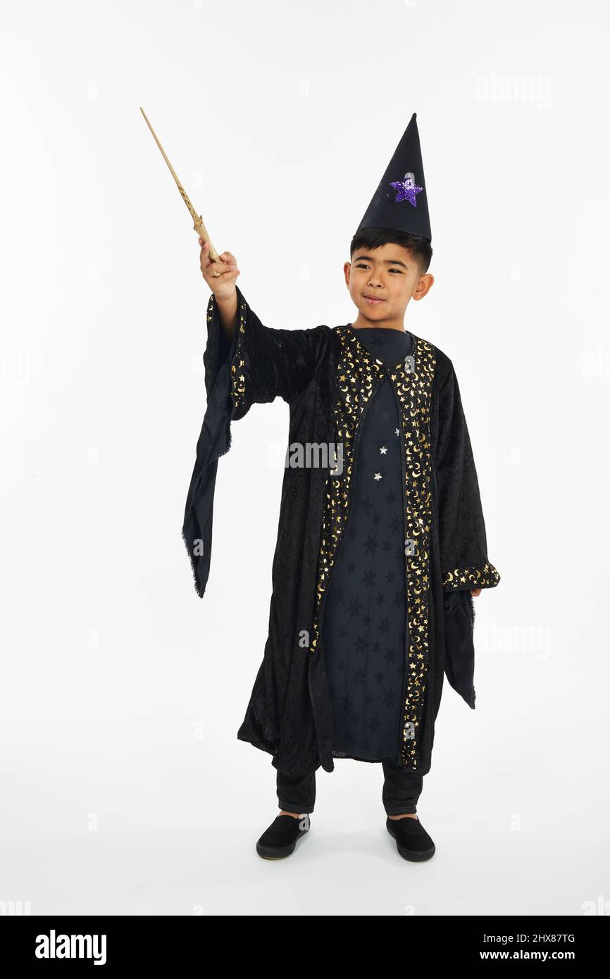 Wizard with a magic wand Stock Photo - Alamy