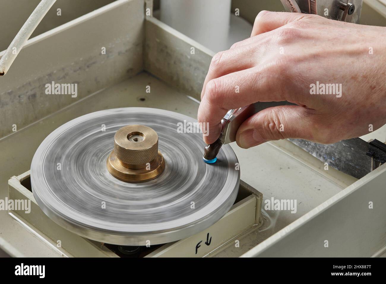 Polishing the 'table' of a gem Stock Photo - Alamy