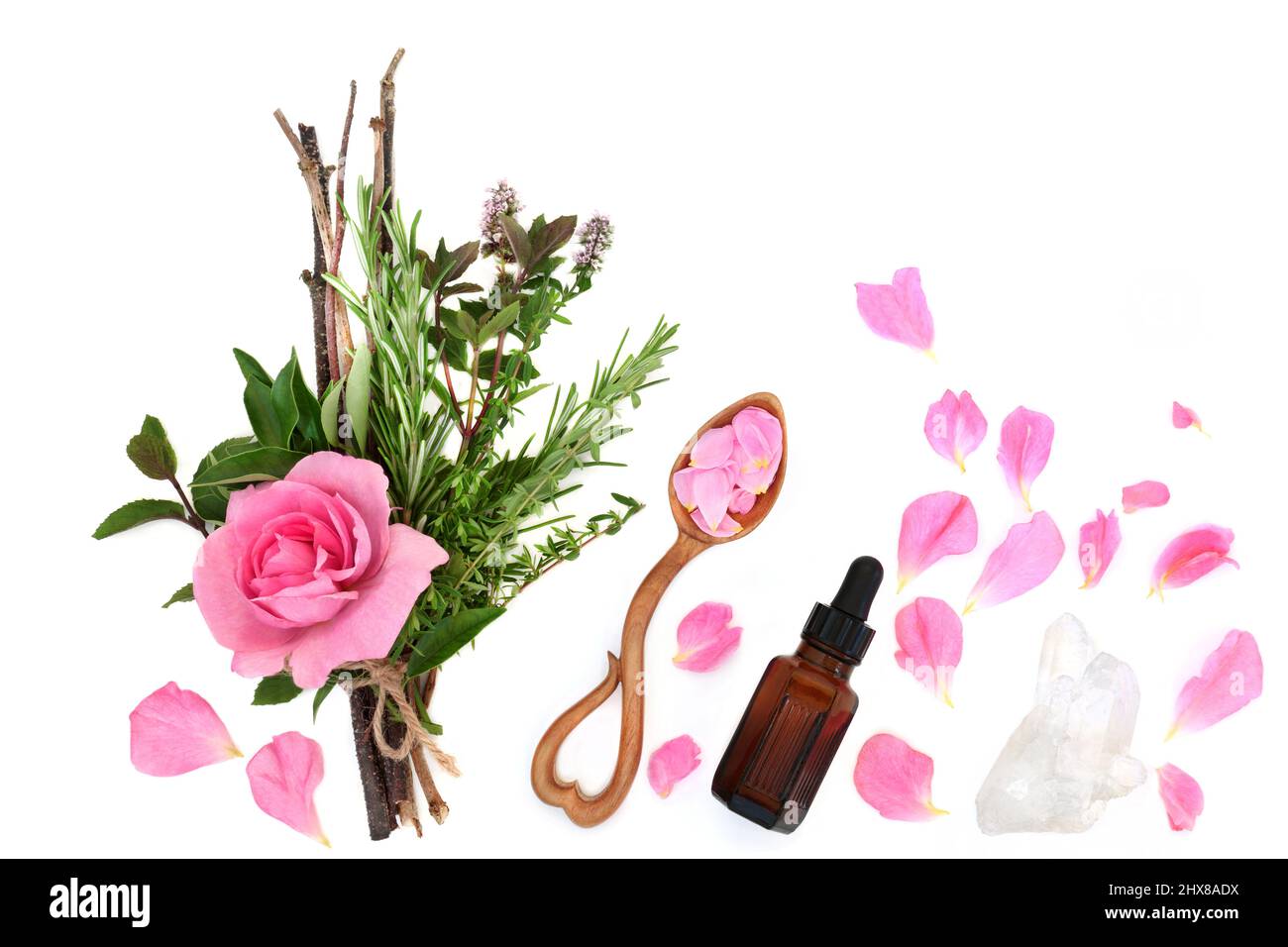Magic love potion preparation with witches bundle of herbs and rose ...