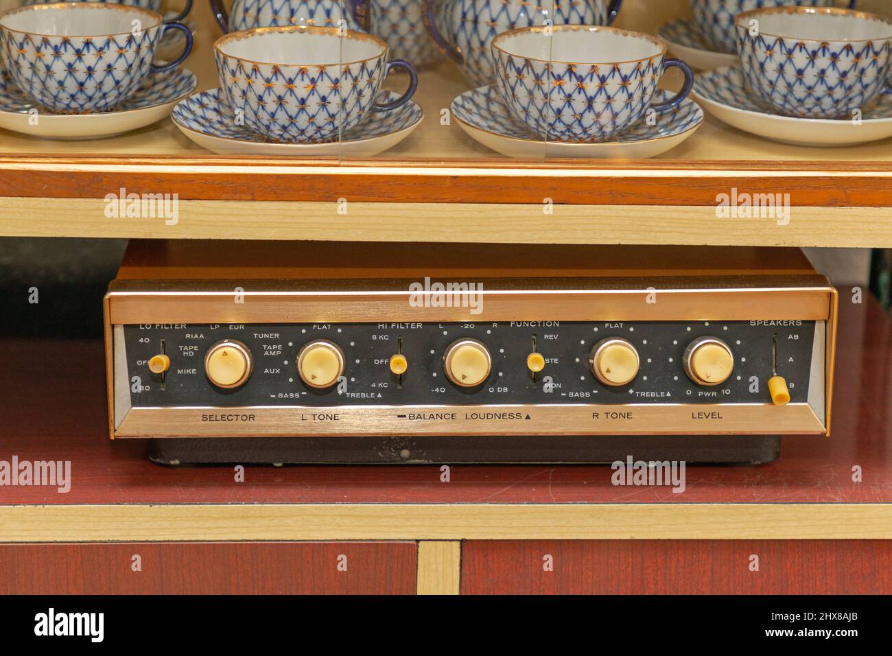 Old Music Amplifier Unit at Wooden Shelf Stock Photo - Alamy