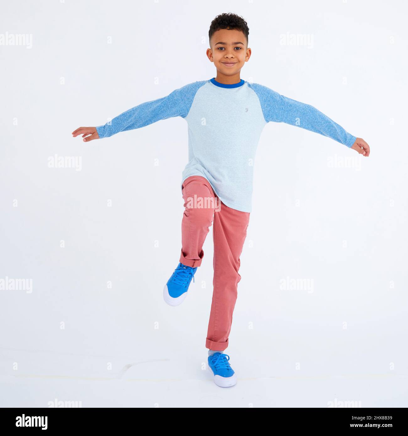 Boy in Steady Balance Pose Stock Photo - Alamy