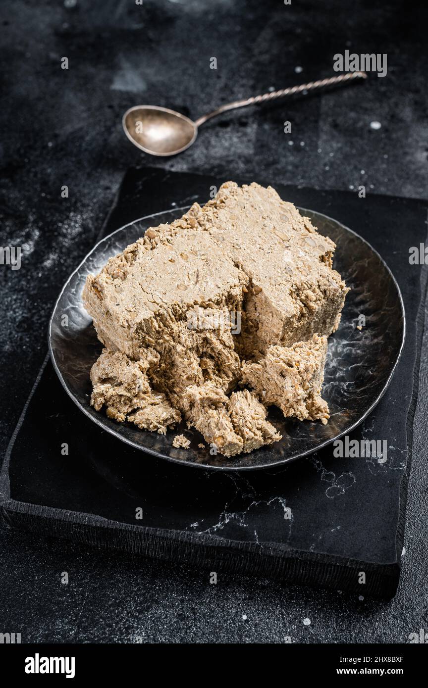 Homemade sunflower halva with honey. Black background. Top view Stock Photo - Alamy