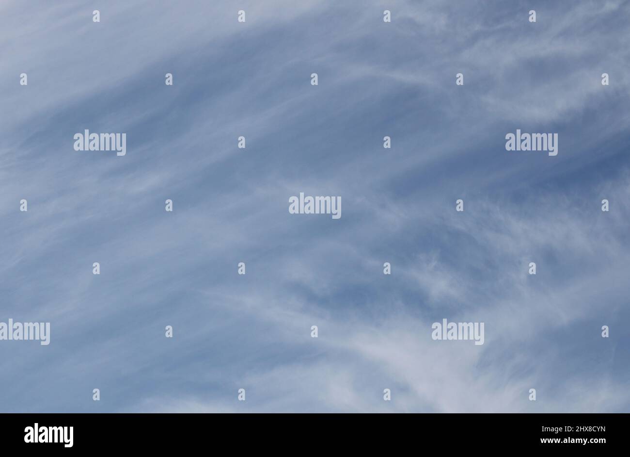 A Simple Blue Sky with Wispy White Clouds Stock Photo - Alamy
