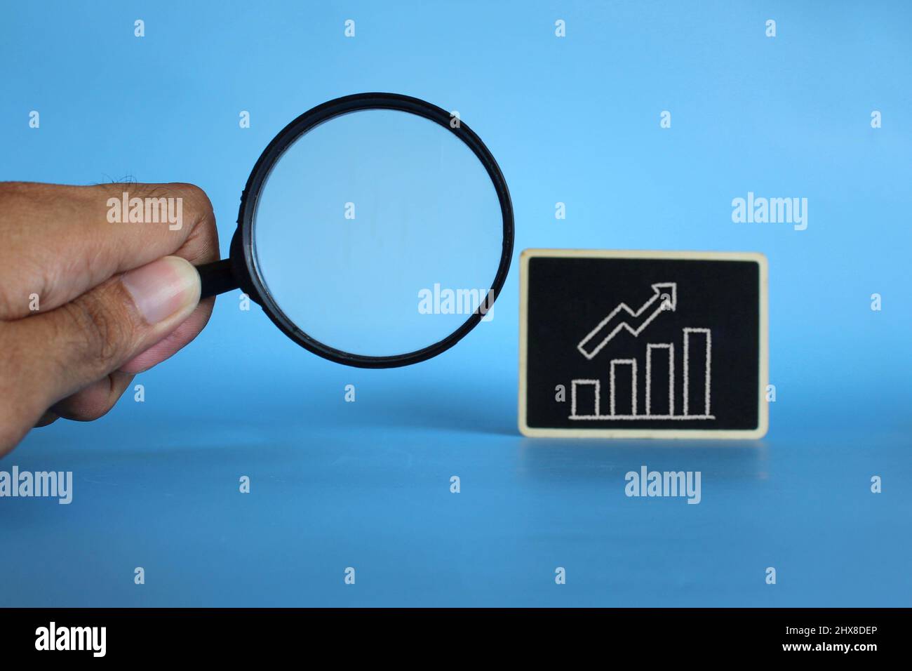 Business analysis concept. Looking at performance chart using ...