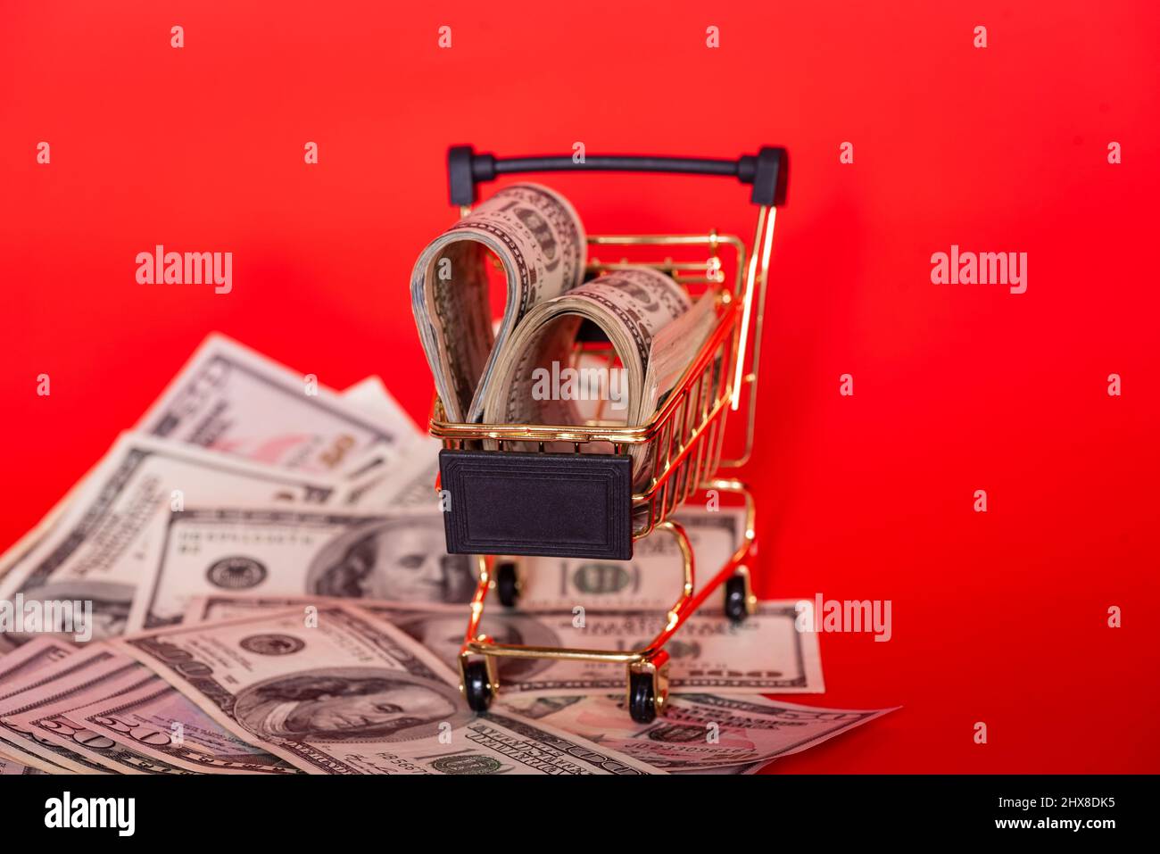 Paper banknotes dollars on a bright red background. Banking and finance ...