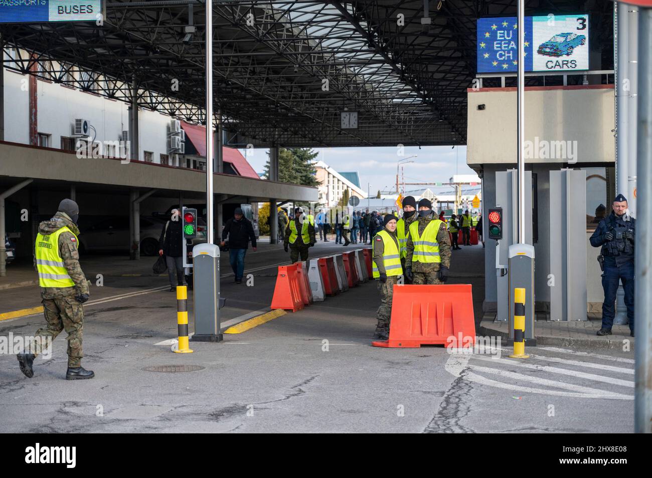 Korczowa, Poland. 10th Mar, 2022. Polish border guards are standing at ...
