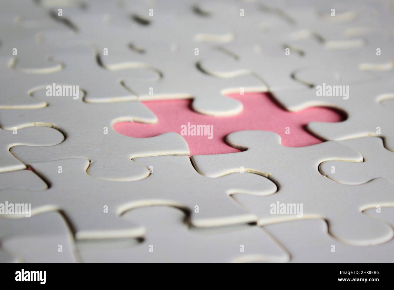 Image of white jigsaw puzzle with missing pieces. Incomplete, solution ...