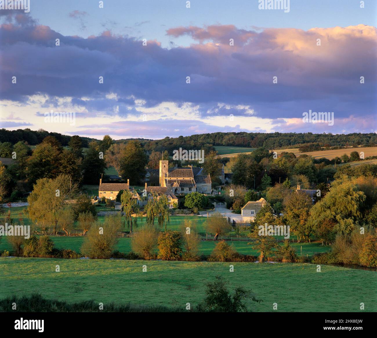 Sunset view over Cotswold village on the Windrush river Stock Photo - Alamy