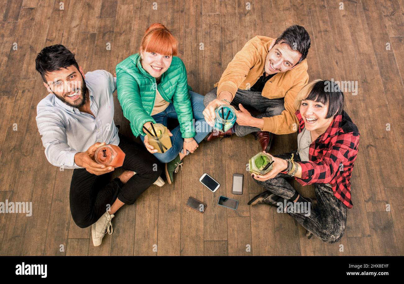 Group of hipster best friends with smartphones in grungy alternative ...