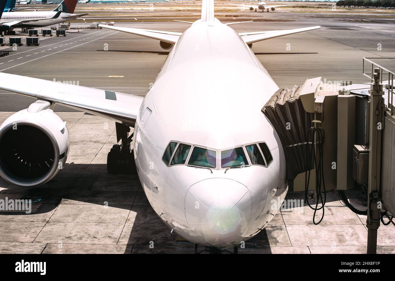 Front view of airplane near airport runway ready to takeoff ...