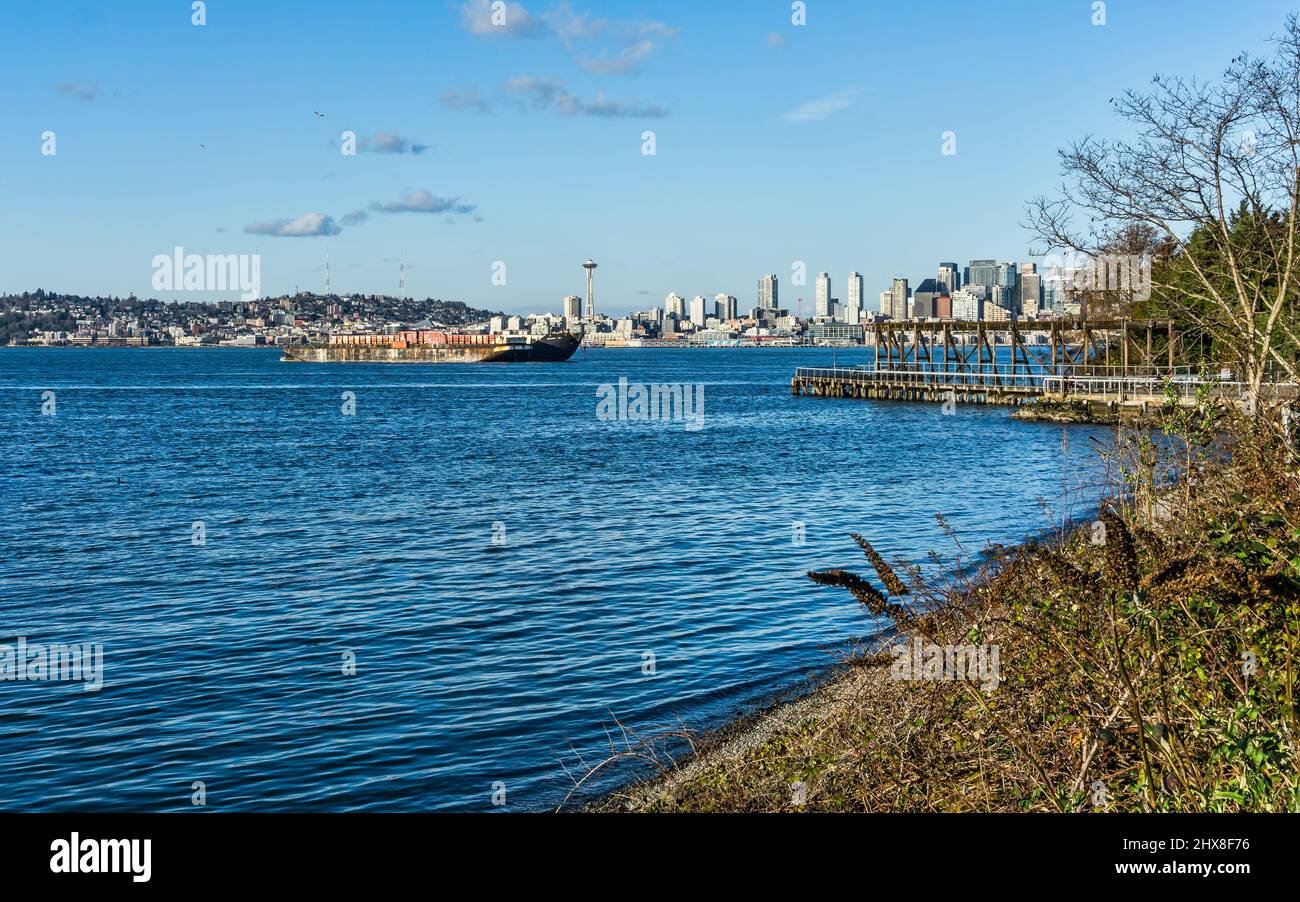 A shipping barge and the Seattle skyline in Washington State Stock ...