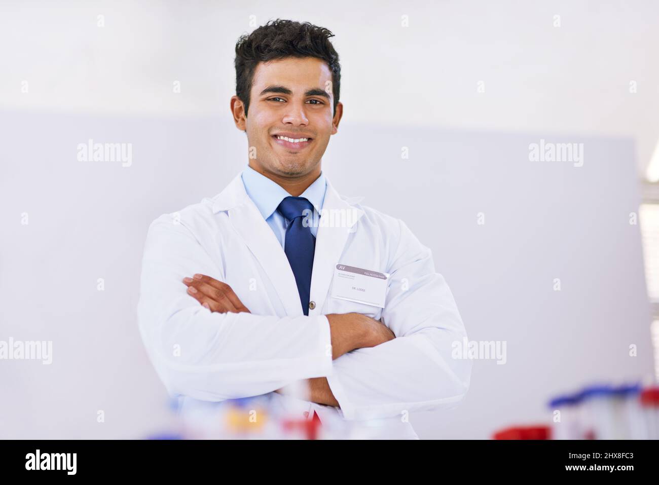 Science is its own satisfaction. Portrait of a smiling lab technician ...