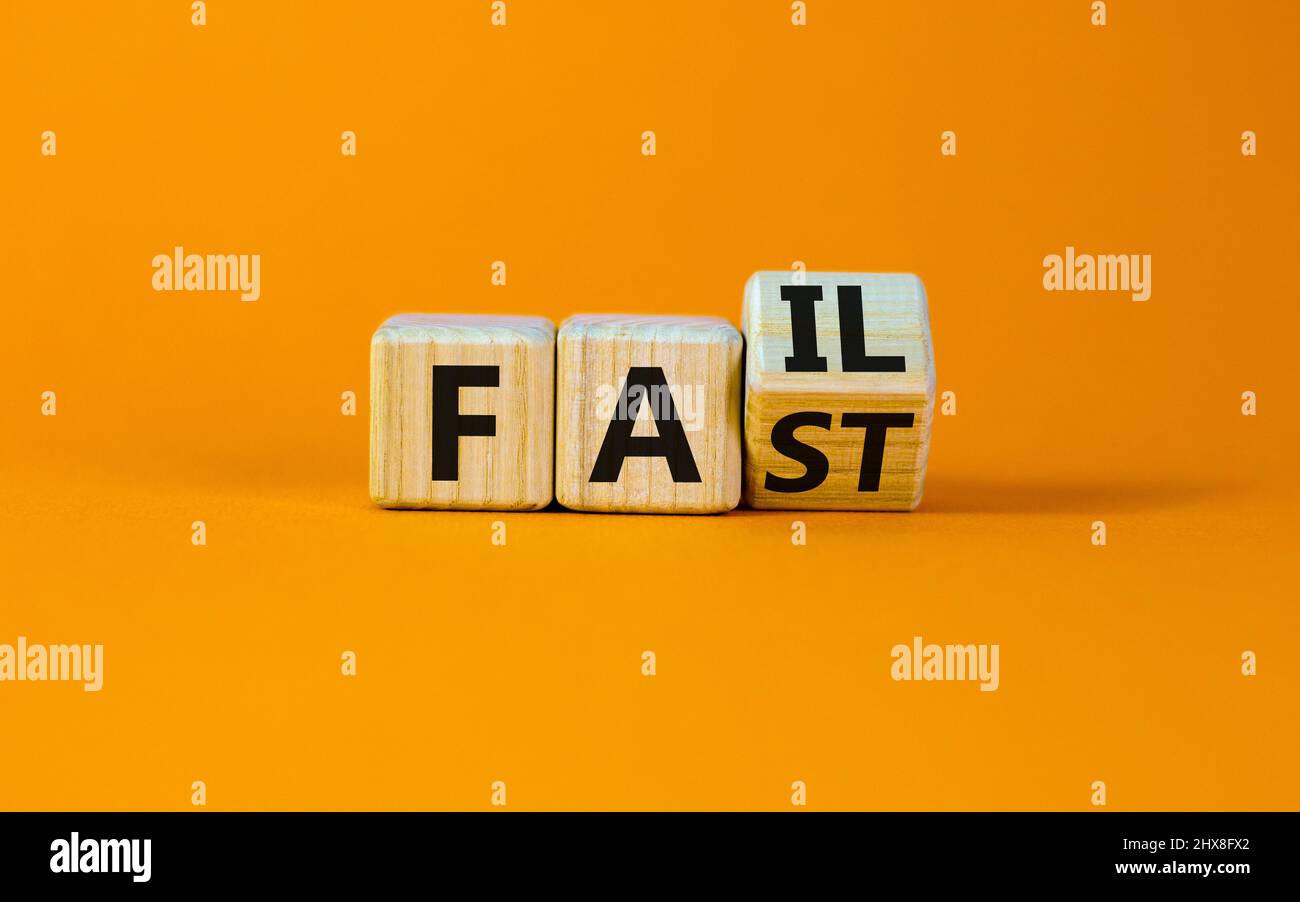 Fail fast symbol. Turned a wooden cube with concept words Fail fast on ...