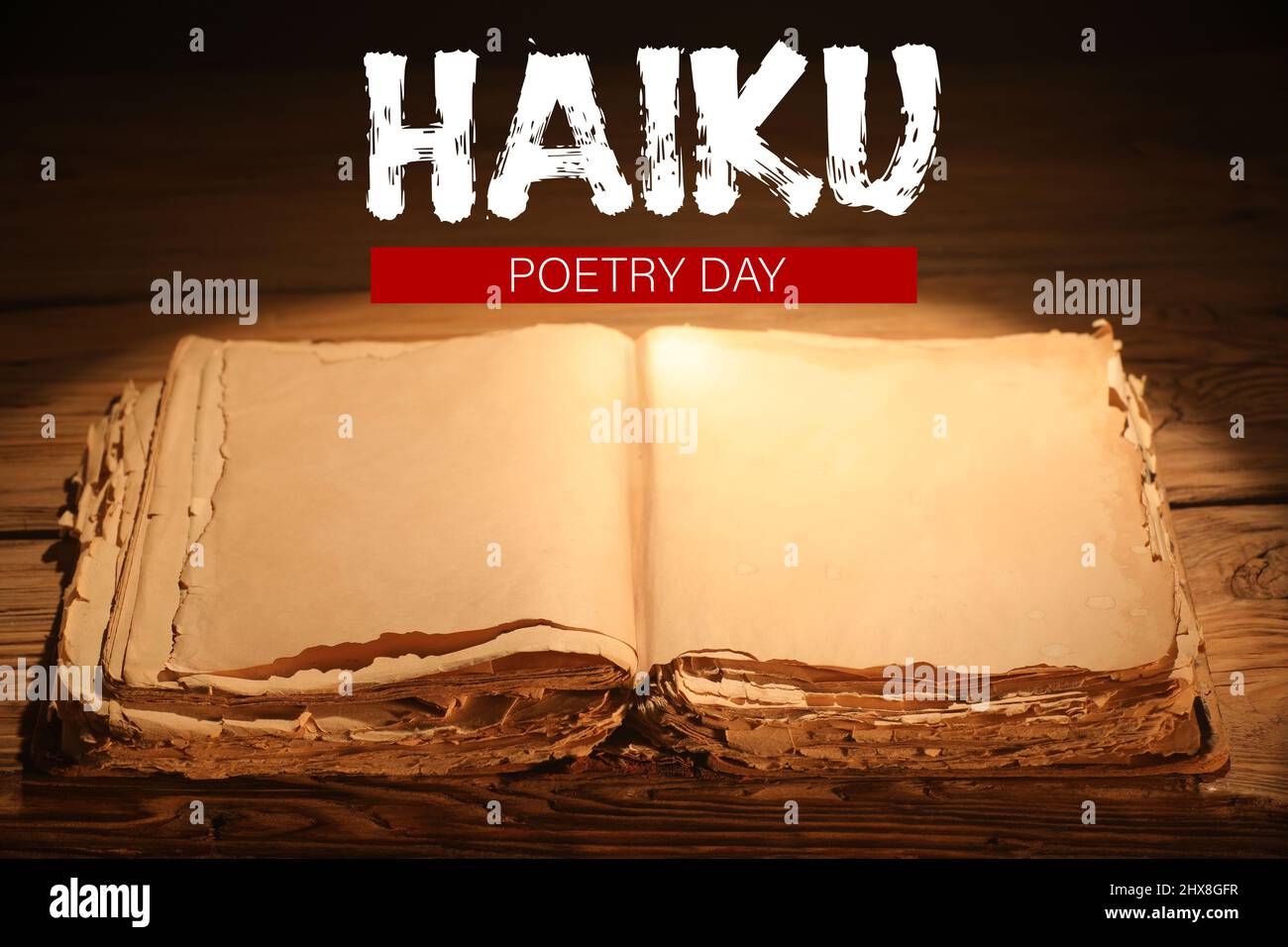 Open old book with text HAIKU POETRY DAY on wooden background Stock ...