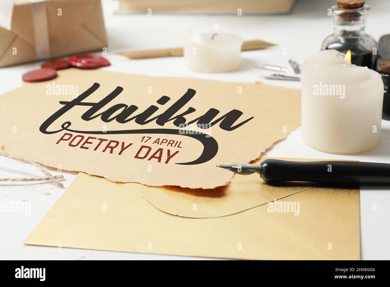 Paper sheet with text HAIKU POETRY DAY 17 APRIL and fountain pen with ...