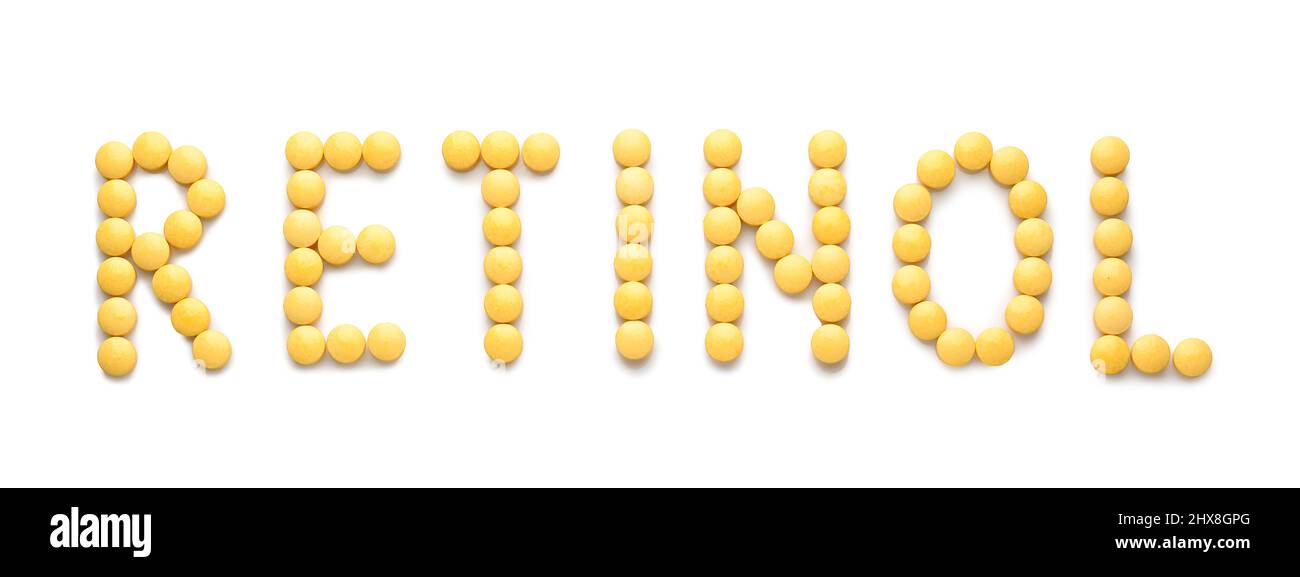 Word RETINOL made of yellow pills on white background Stock Photo - Alamy