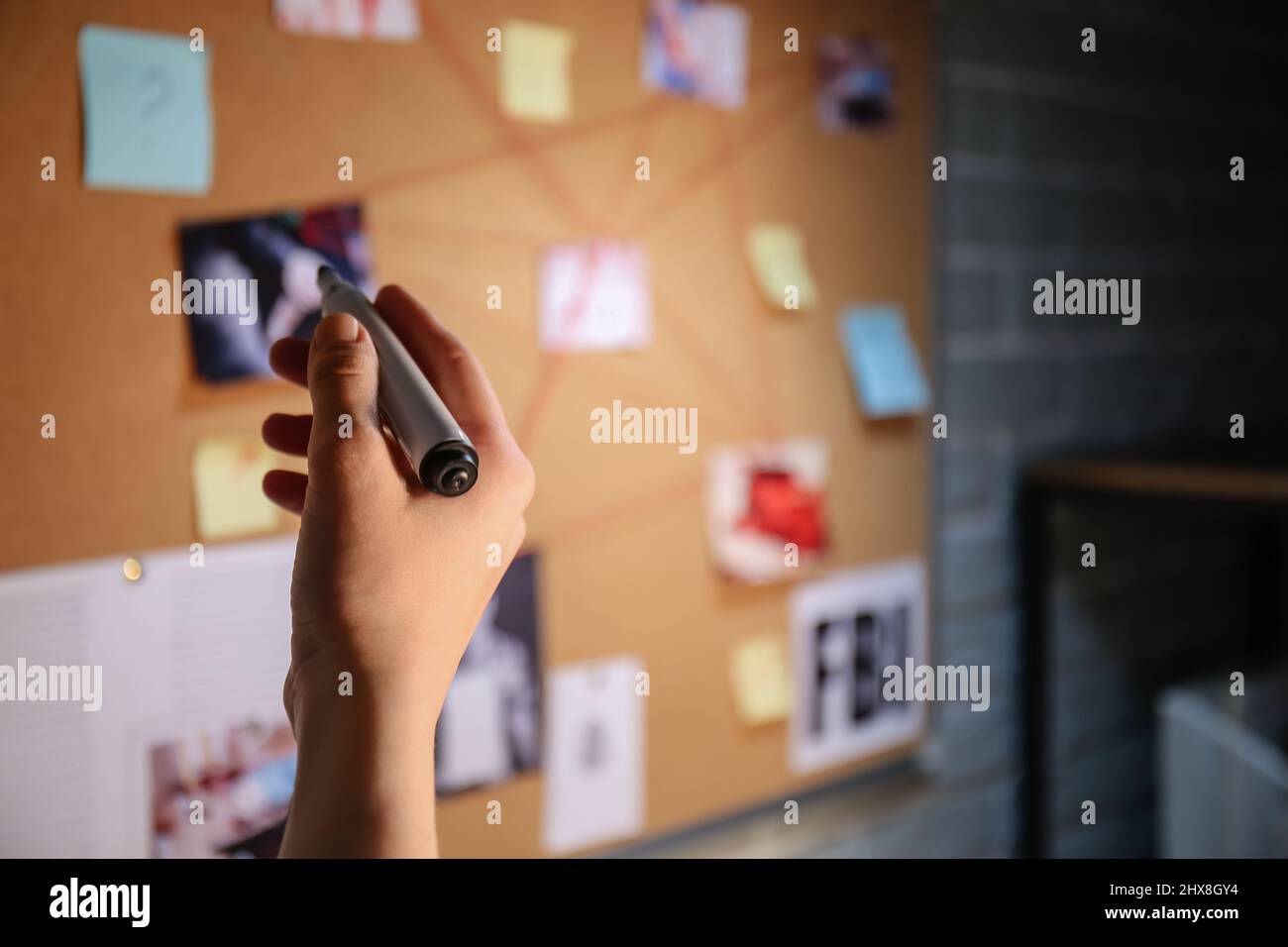 Detective processing evidence in FBI agent's office Stock Photo - Alamy
