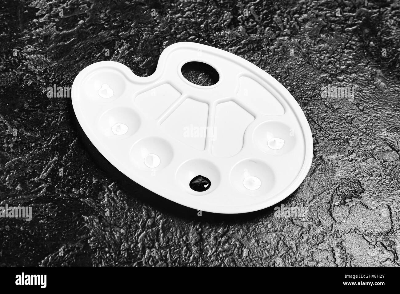 White paint palette on dark background. Concept of racism Stock Photo ...