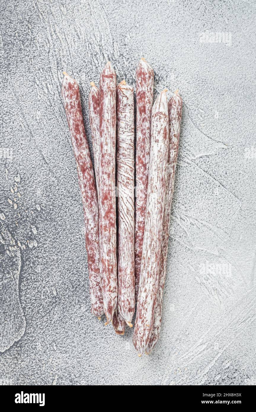 Traditional Spanish mini fuet sausage. White background. Top view Stock ...