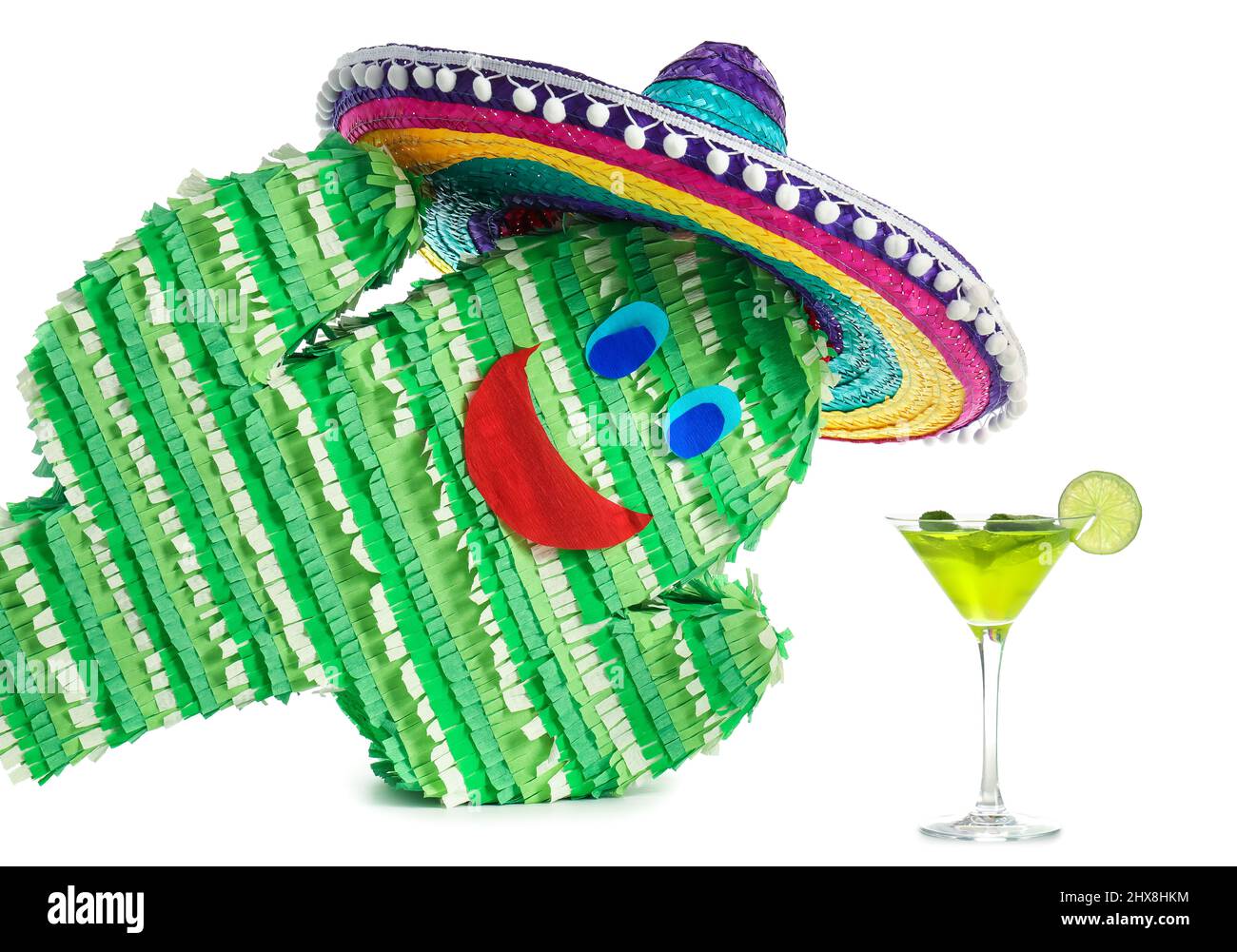 Mexican pinata with sombrero and glass of tasty cocktail on white ...