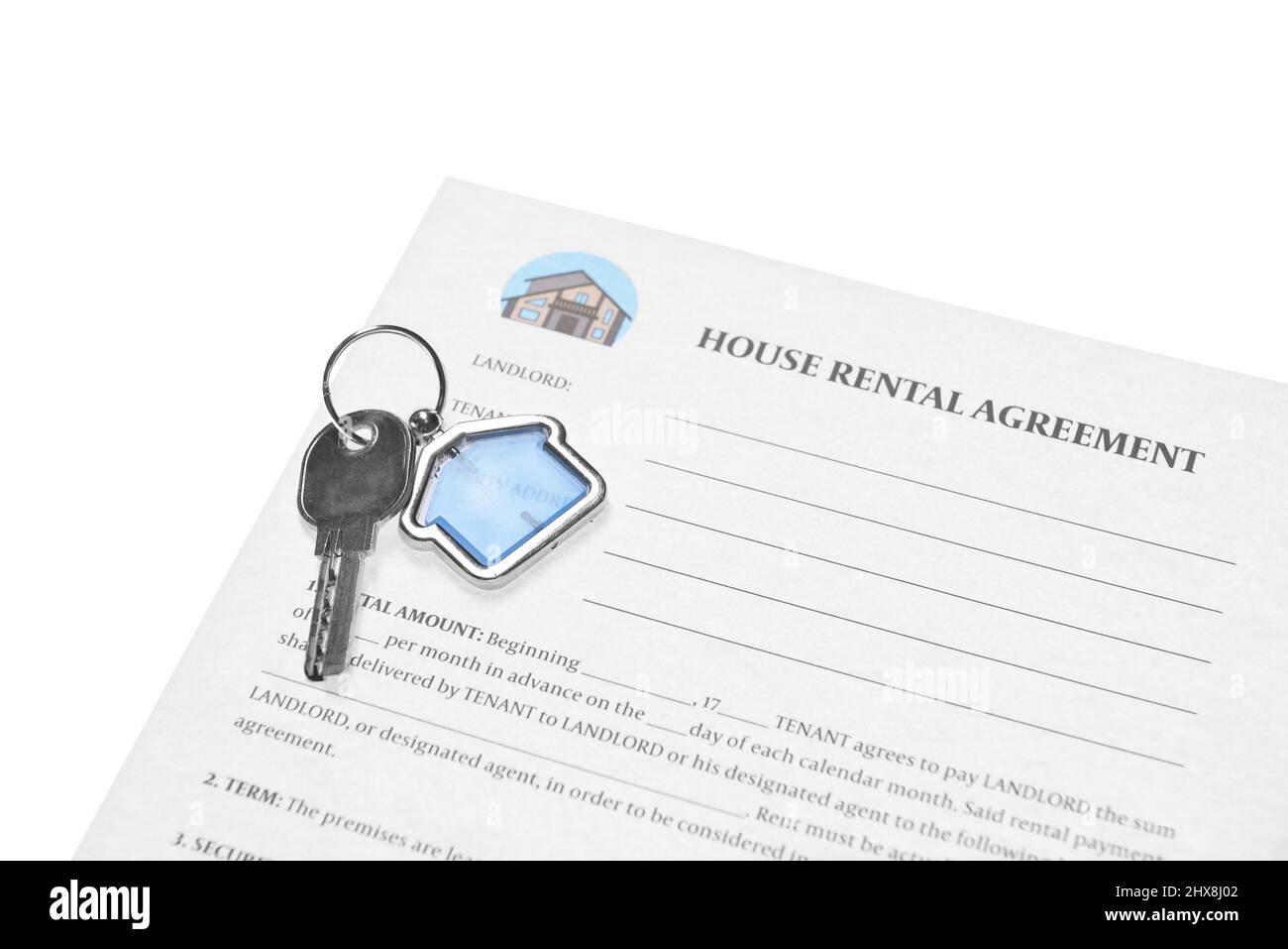 House rental agreement and key with house shaped keychain on white ...