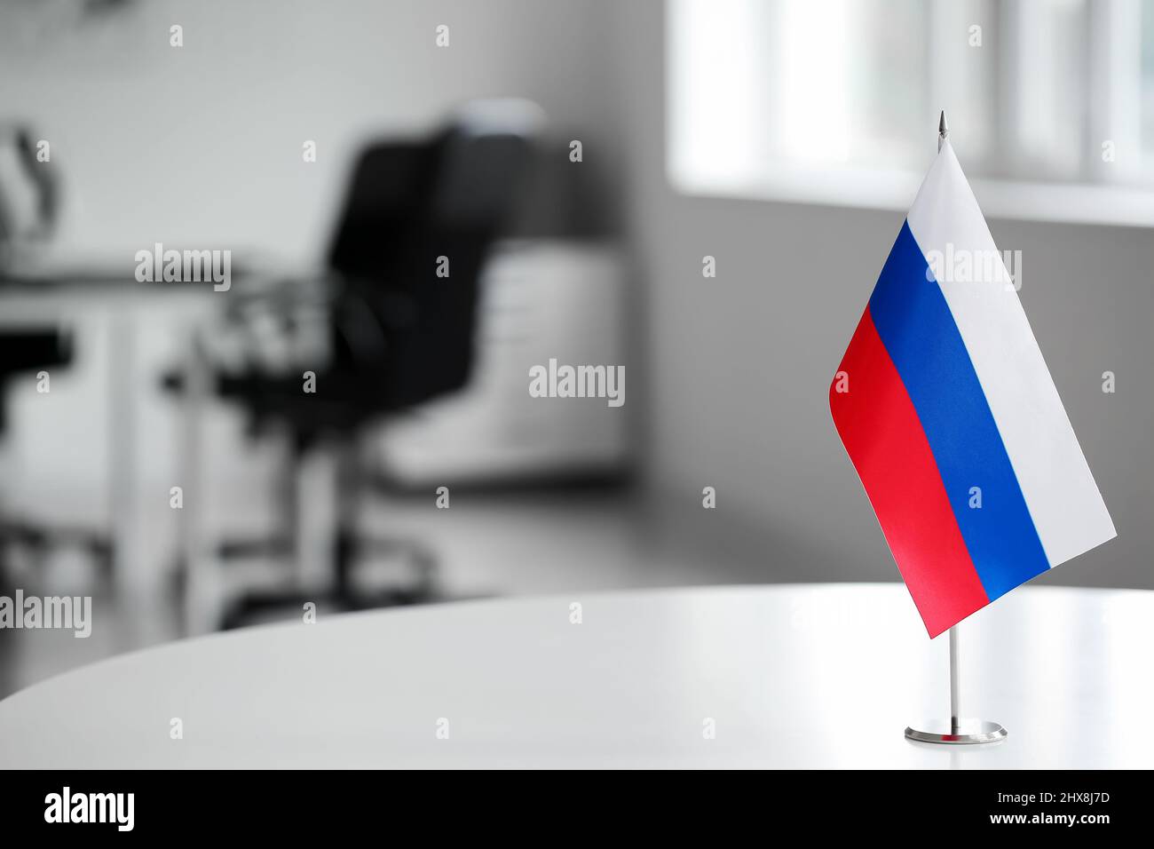 Russian flag on white table in meeting room Stock Photo - Alamy