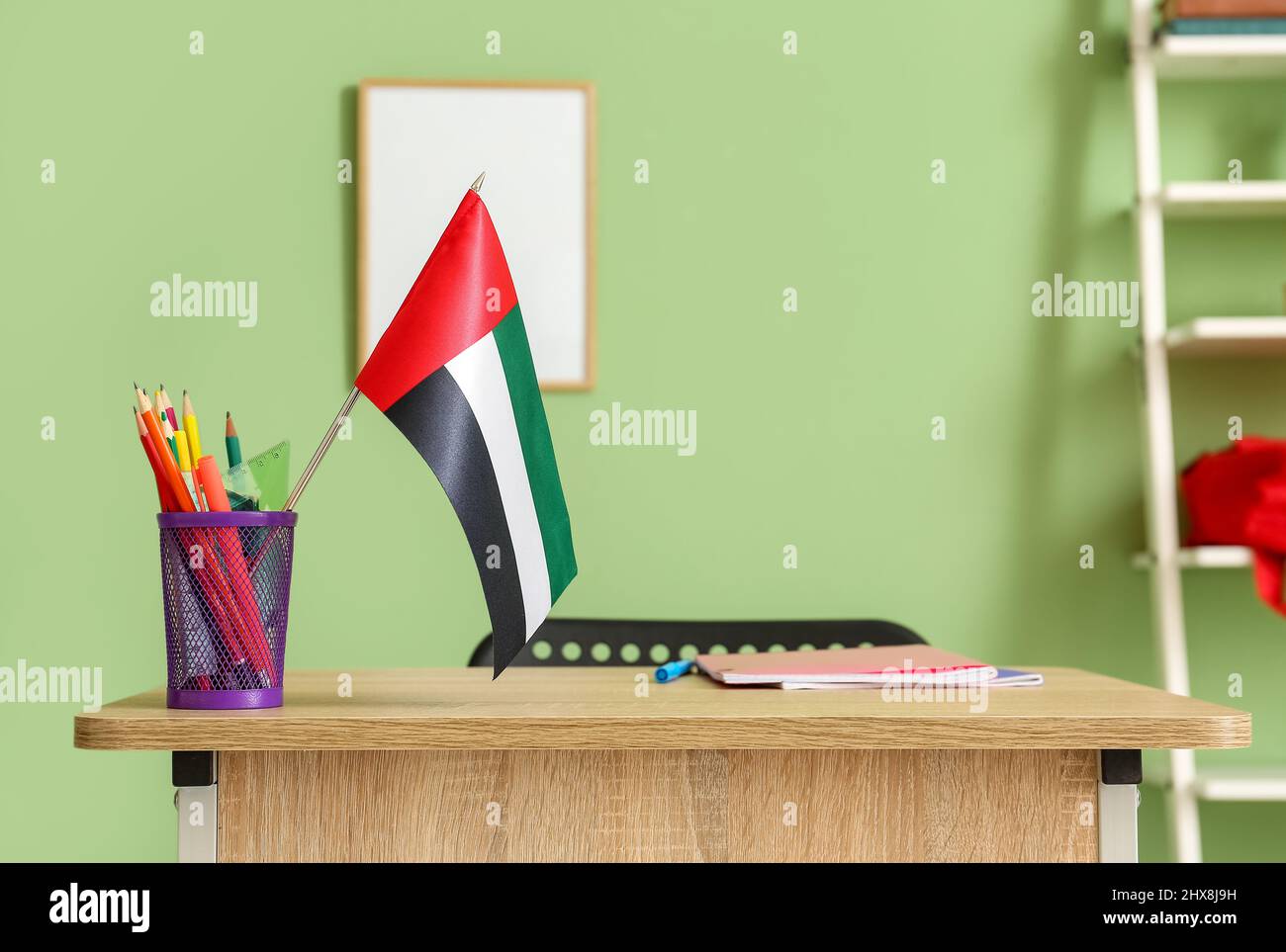 Stationery with UAE flag on desk in room Stock Photo - Alamy