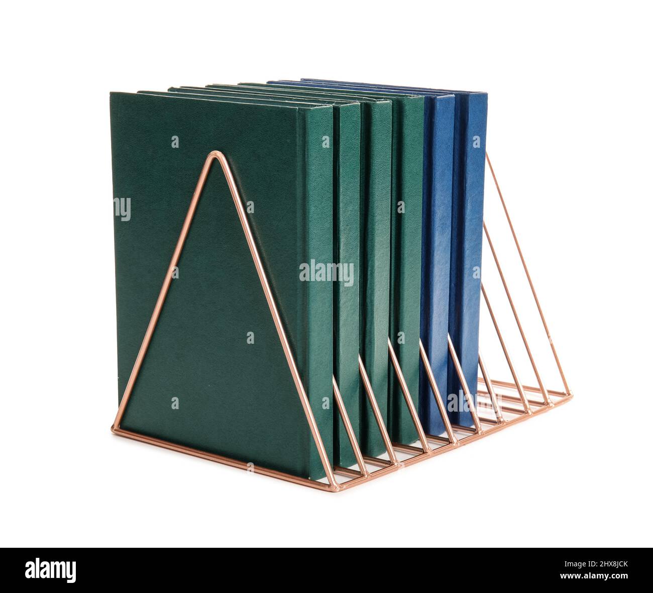 Metal organizer with books on white background Stock Photo - Alamy