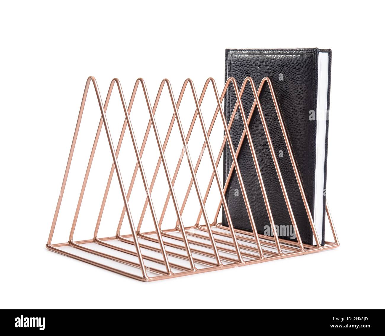 Metal organizer with book on white background Stock Photo - Alamy