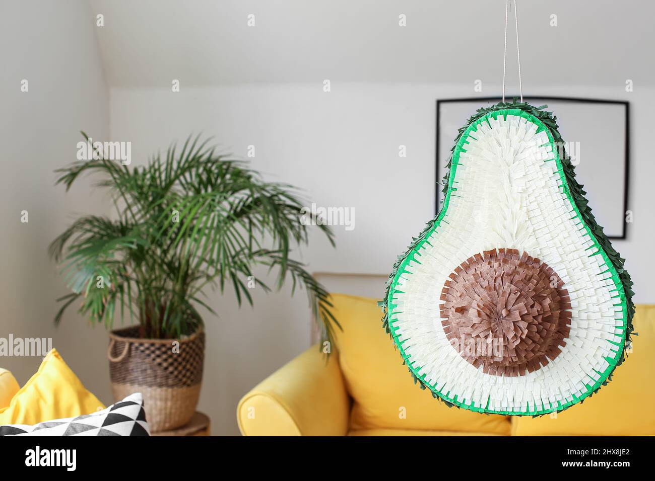 Mexican pinata hanging in stylish living room Stock Photo - Alamy