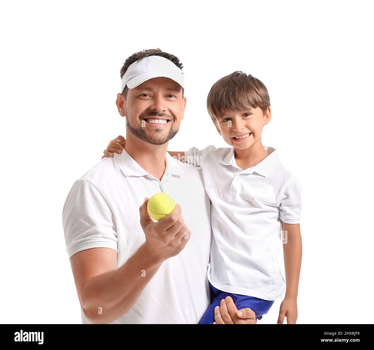 Little boy and his father with tennis ball on white background Stock ...