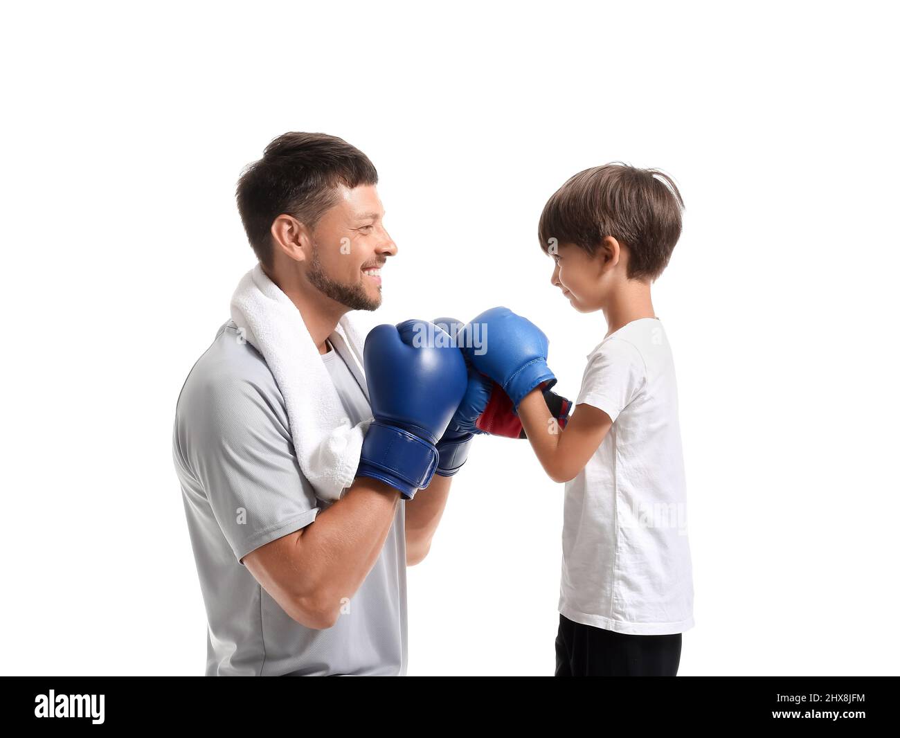 Little boy with and his boxing trainer on white background Stock Photo ...