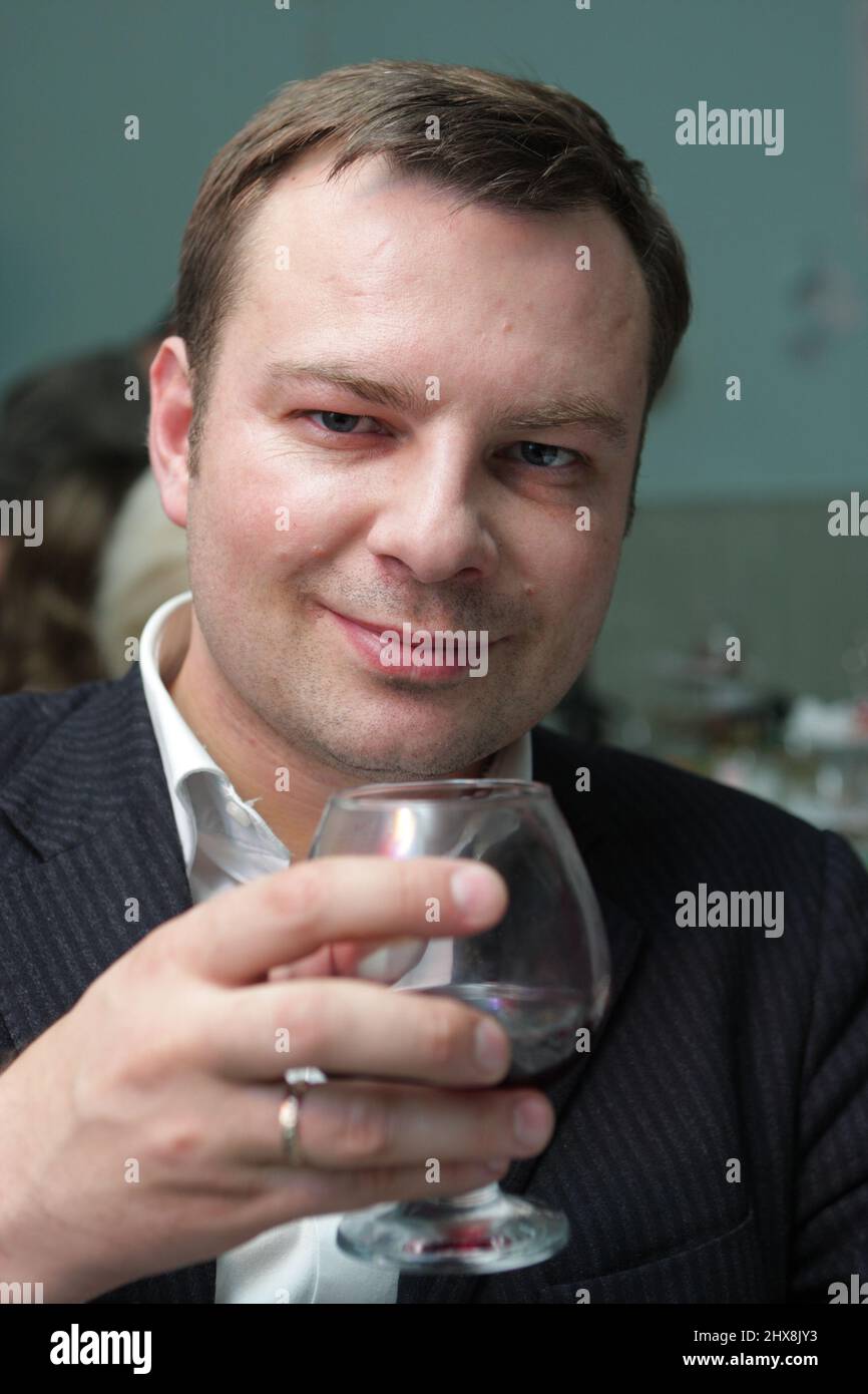 Portrait of the happy man with brandy Stock Photo - Alamy